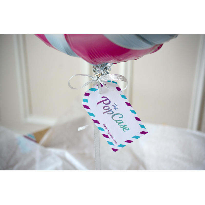 Livraison d'un ballon cadeau candy rose gonflé à l'hélium